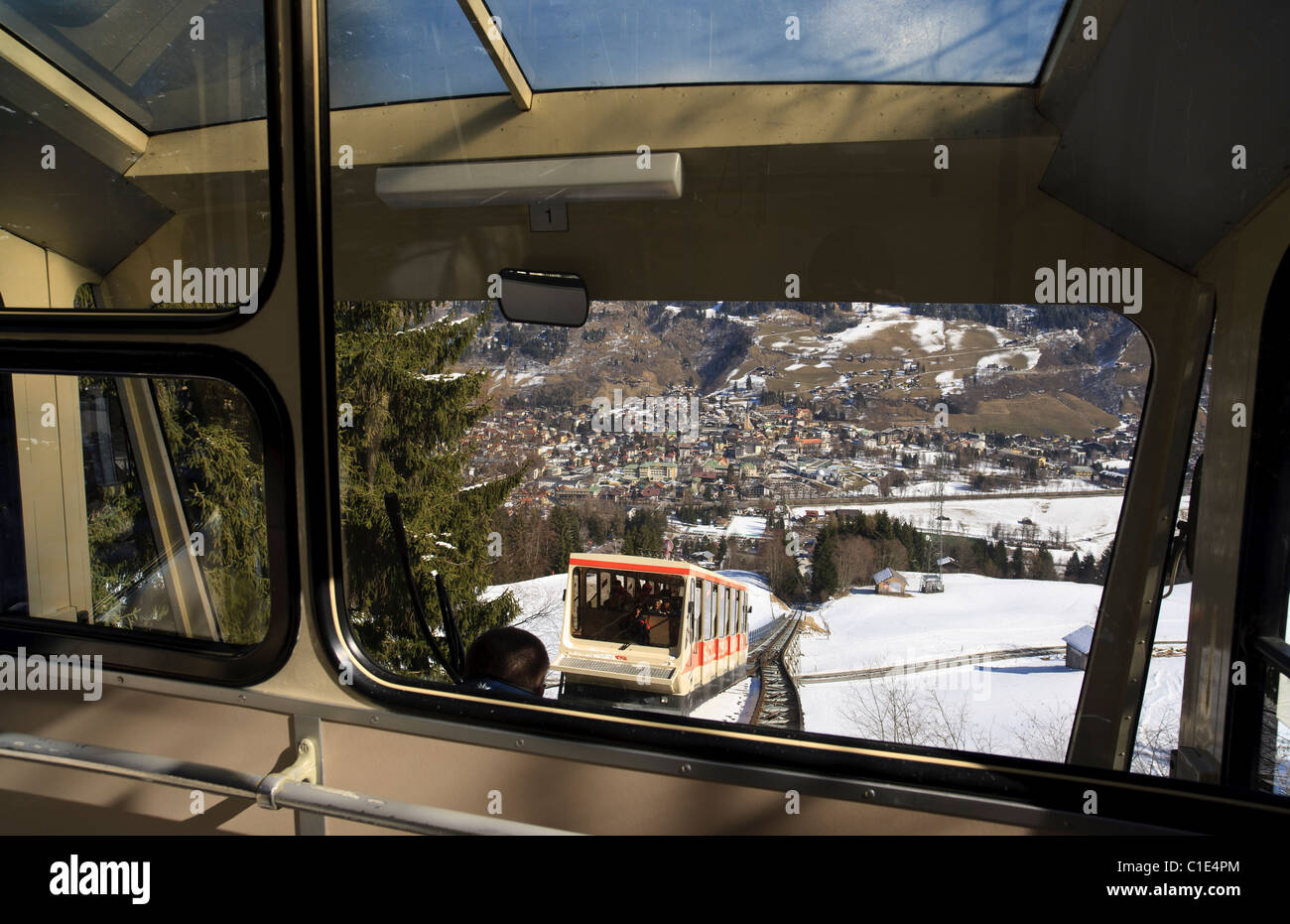 Two funicular railway wagons pass each other above the Austrian ski resort of Bad Hofgastein ...