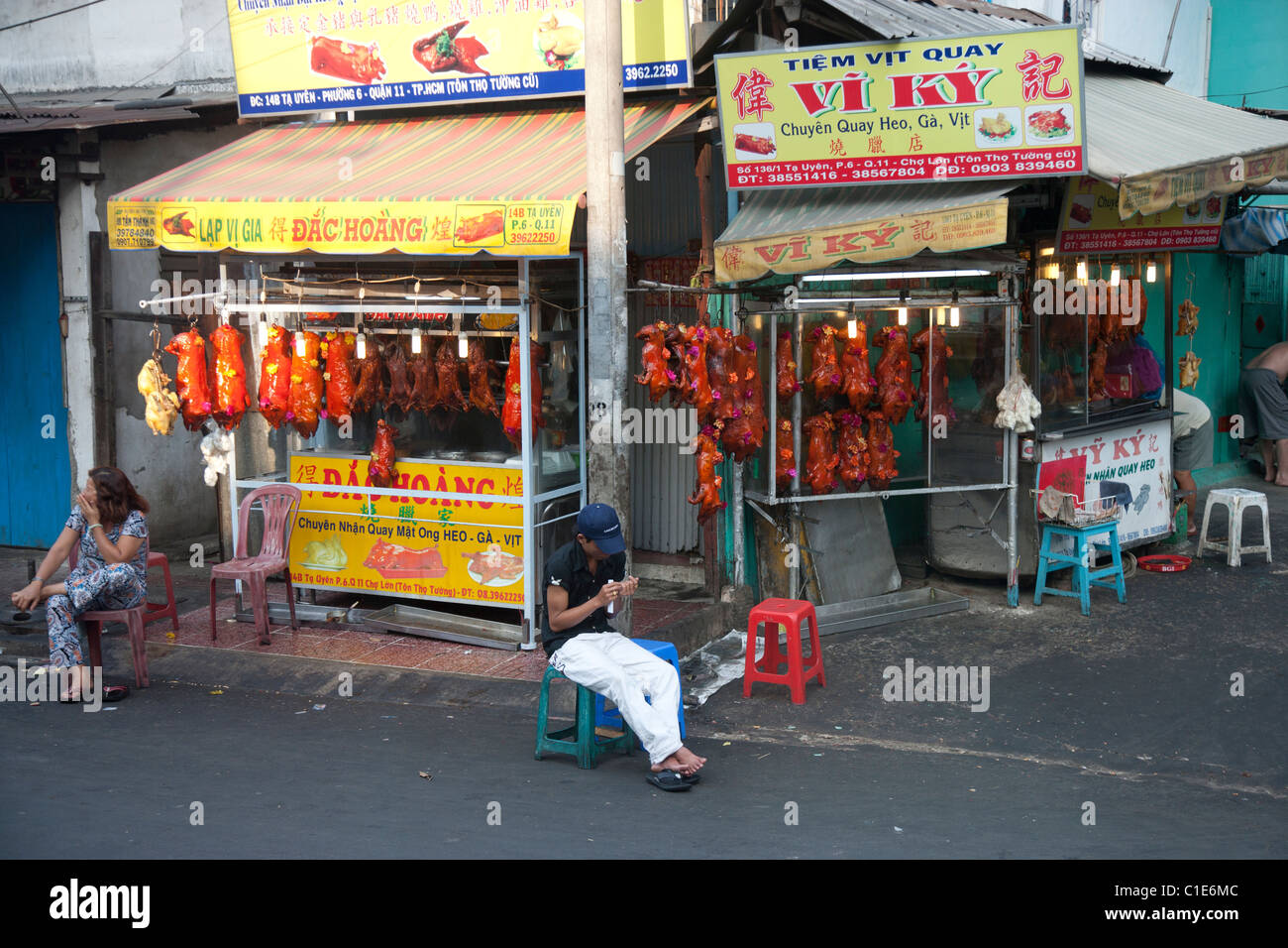 Shop selling Roasted Pigs in Saigon Stock Photo - Alamy