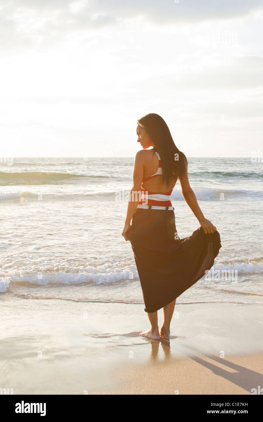 Model at the beach at sunset Stock Photo - Alamy