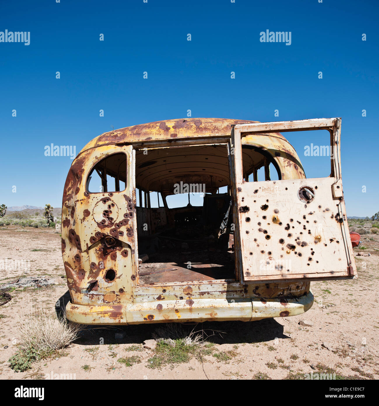 Abandoned bus with rusty bullet holes, Mojave desert, California Stock ...