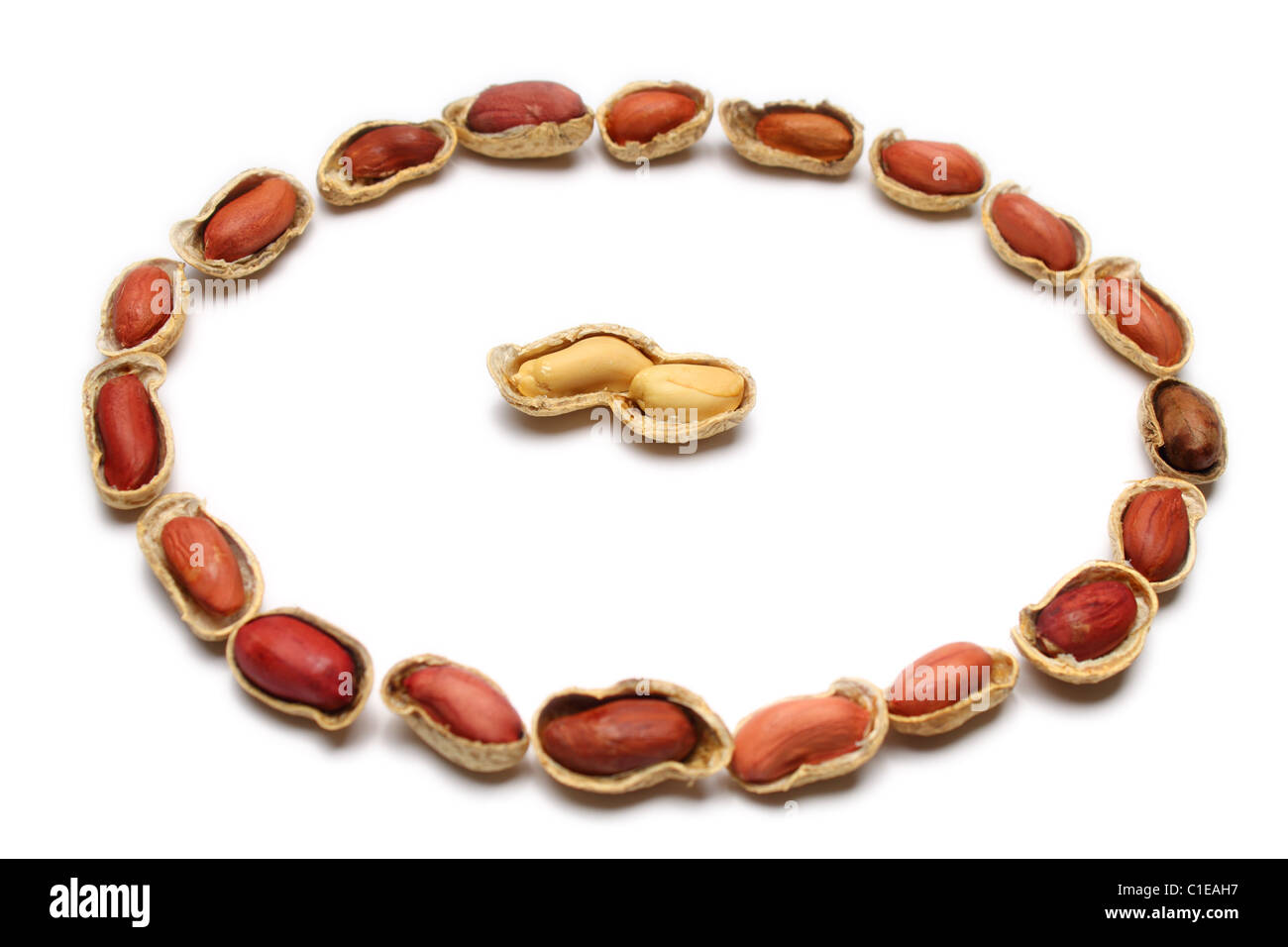 Peanut couple surrounded by a circle of single peanuts Stock Photo - Alamy