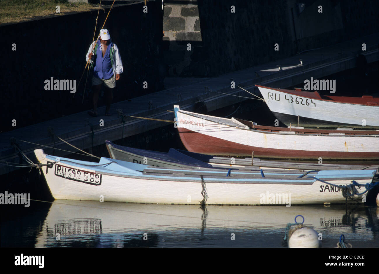 Fisherman on dock, Saint Pierre port, La Reunion island (France ...