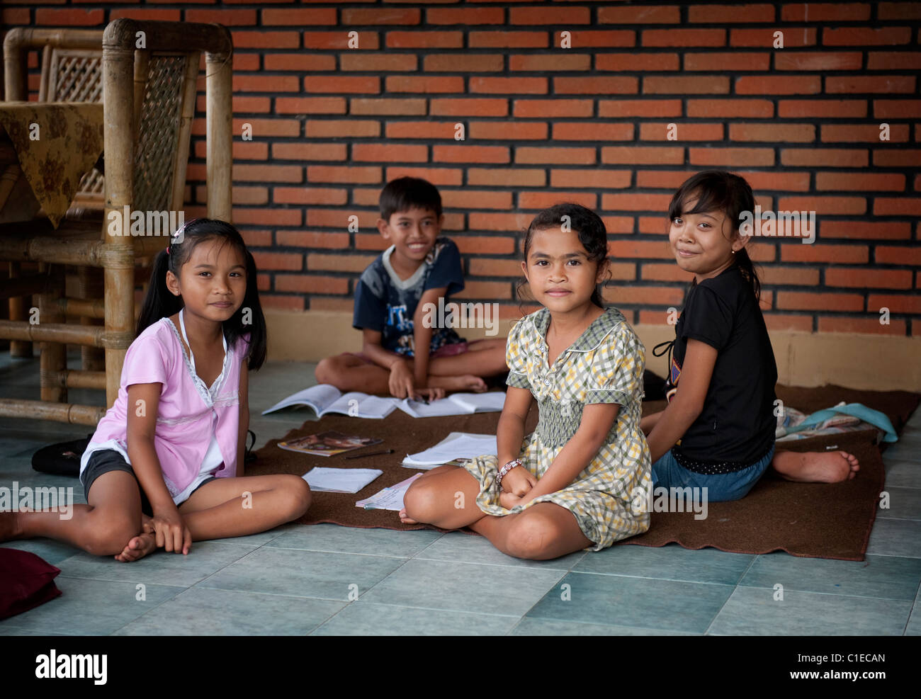 Smiling and happy Balinese children from a village in east Bali called ...