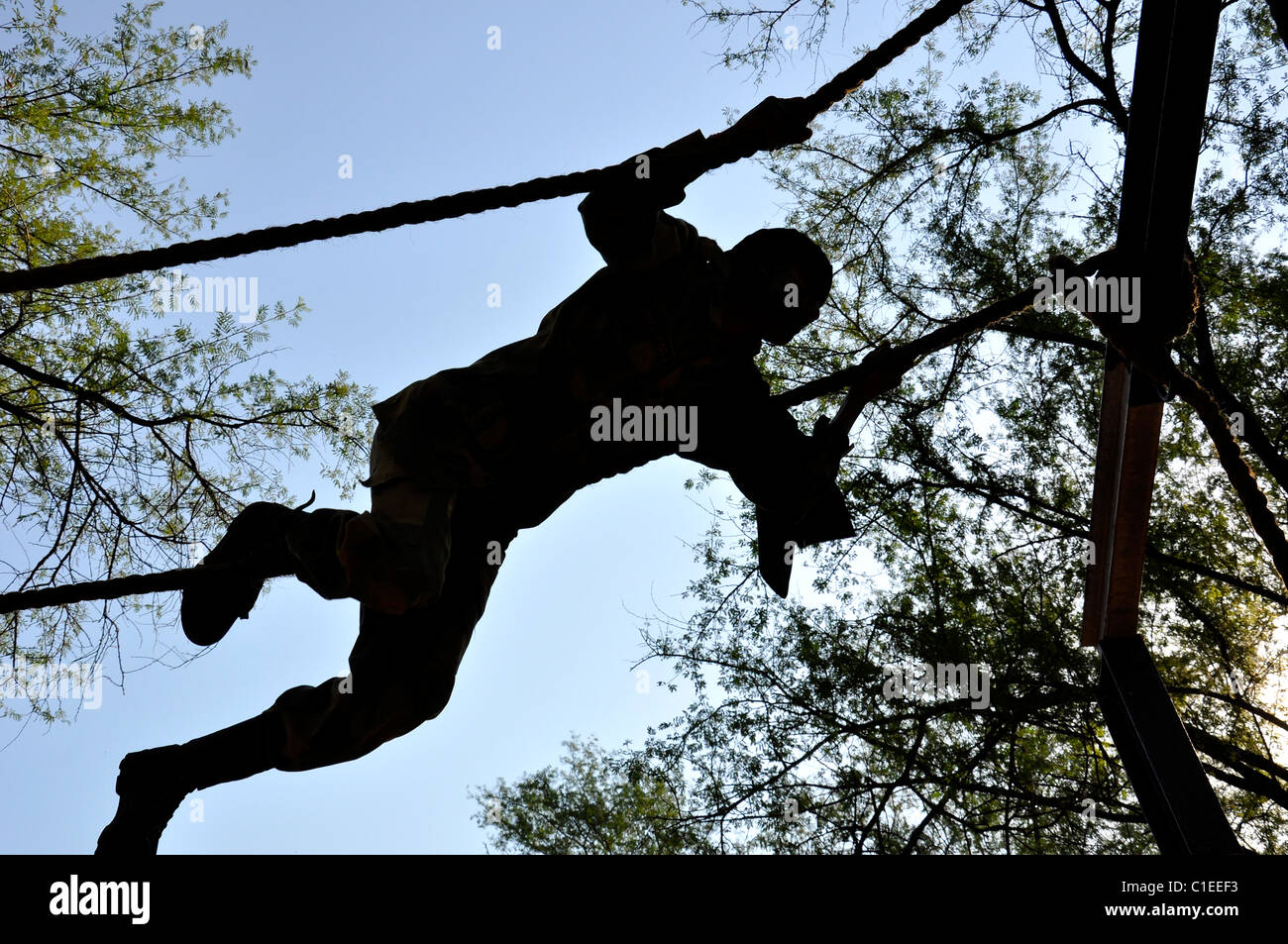 A soldier crossing the rope Stock Photo - Alamy