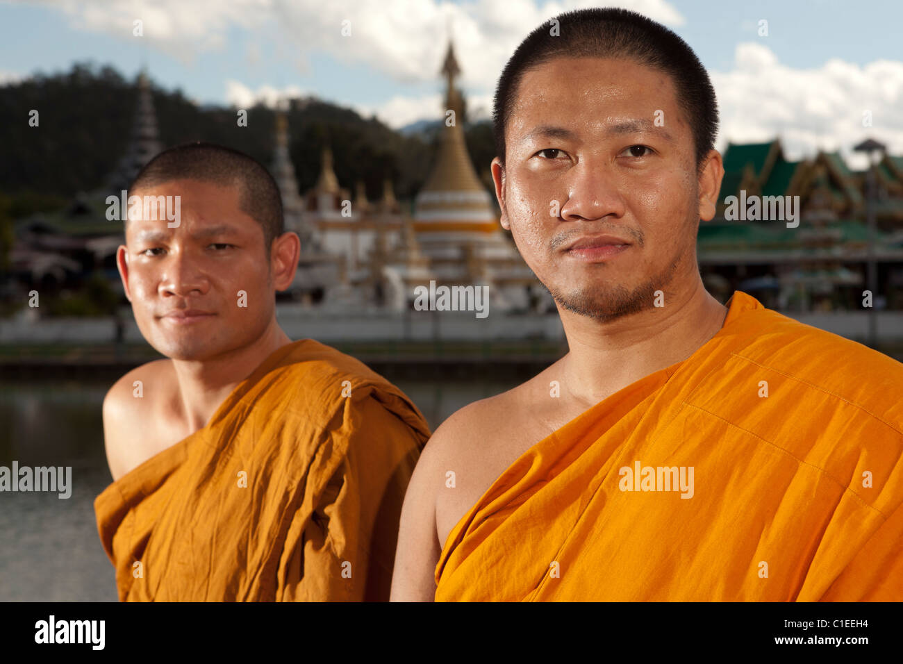 Two monks take rest Jong Kham temple lake, Mae Hong Son, Thailand Stock ...