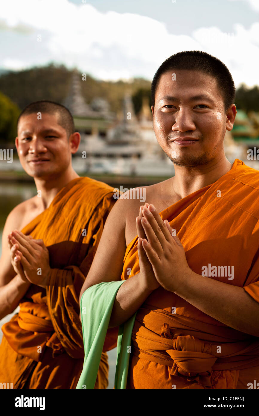 Two monks take rest Jong Kham temple lake, Mae Hong Son, Thailand Stock ...