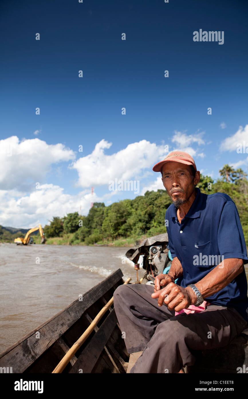 Boat man drive the boat to Karen long neck refugee village at river pai ...