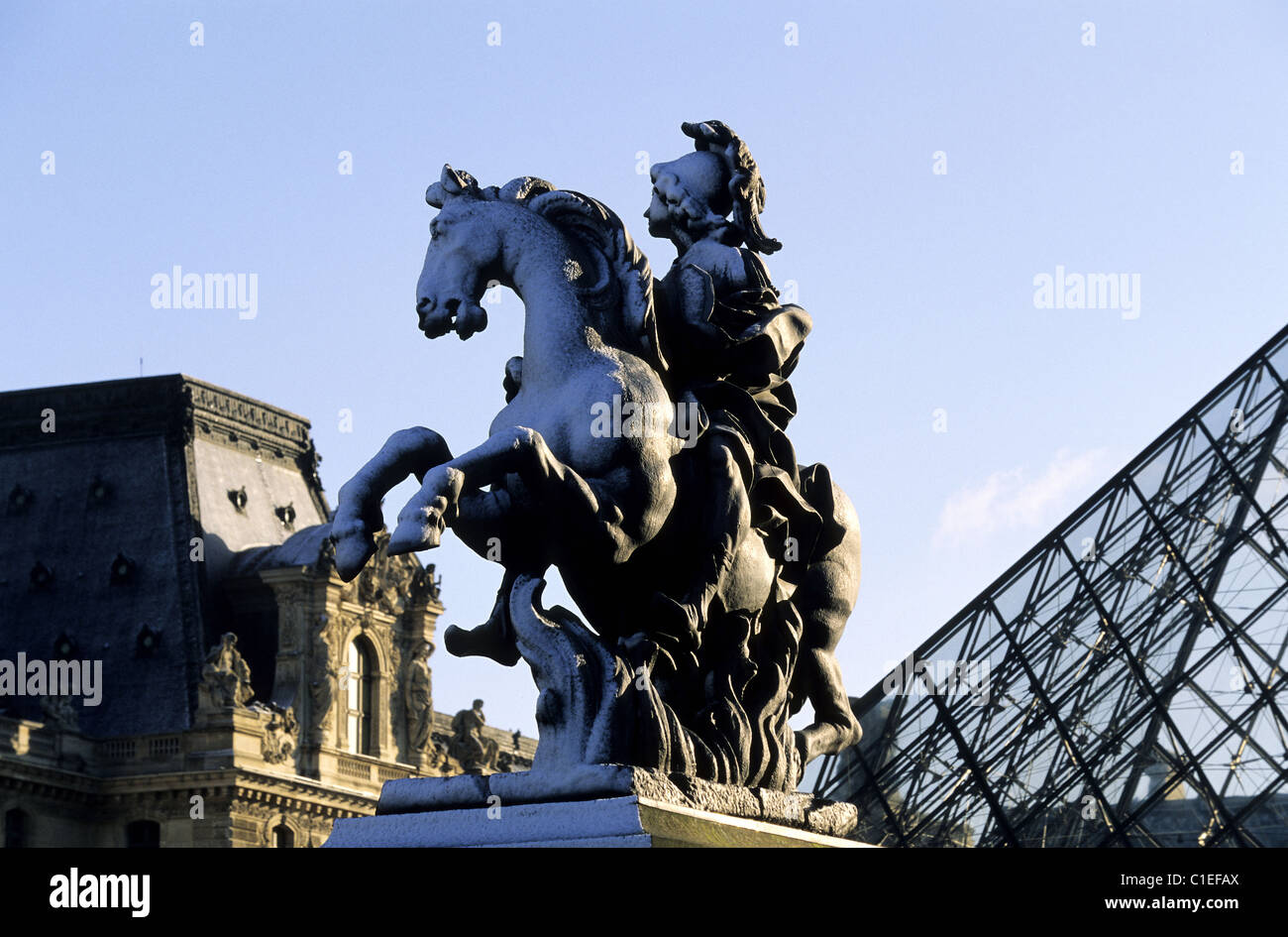 France, Paris, equestrian statue of the Louvre under snow Stock Photo ...