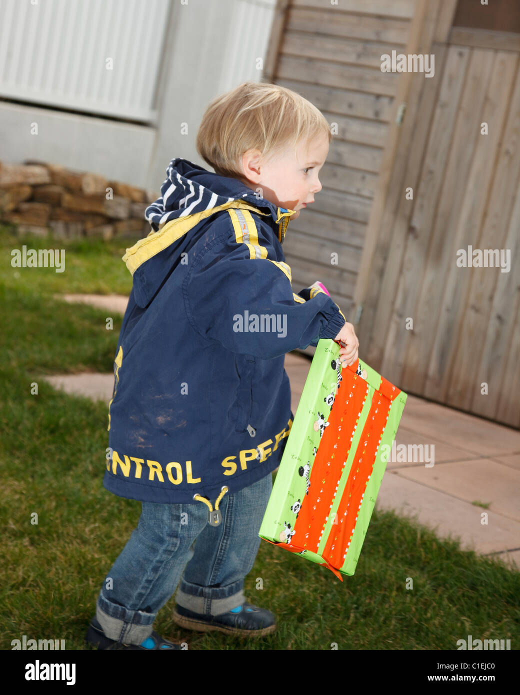 little boy with present Stock Photo - Alamy