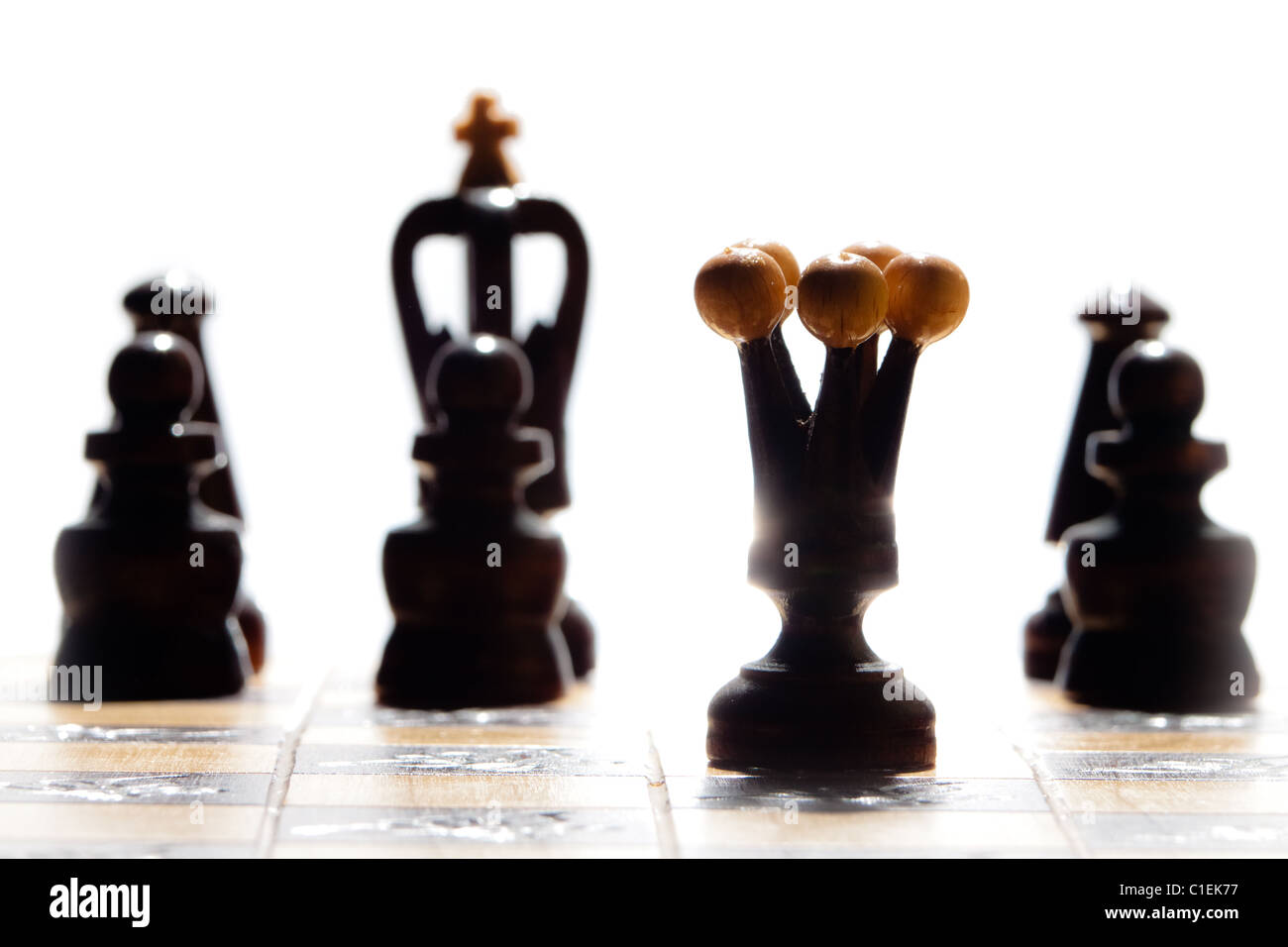 Chess leader with queen on front Stock Photo - Alamy