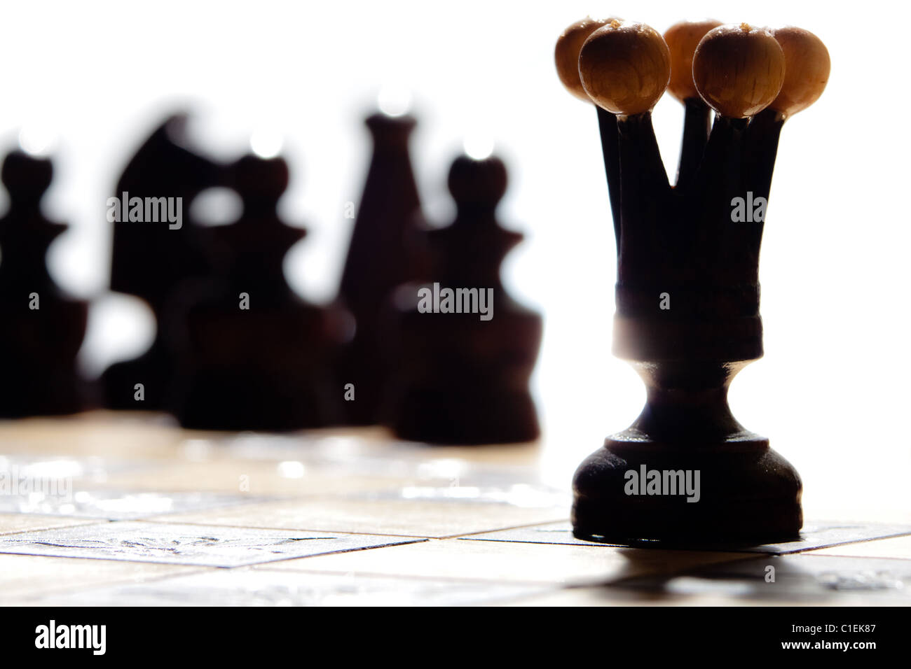 Chess leader with queen on front Stock Photo - Alamy