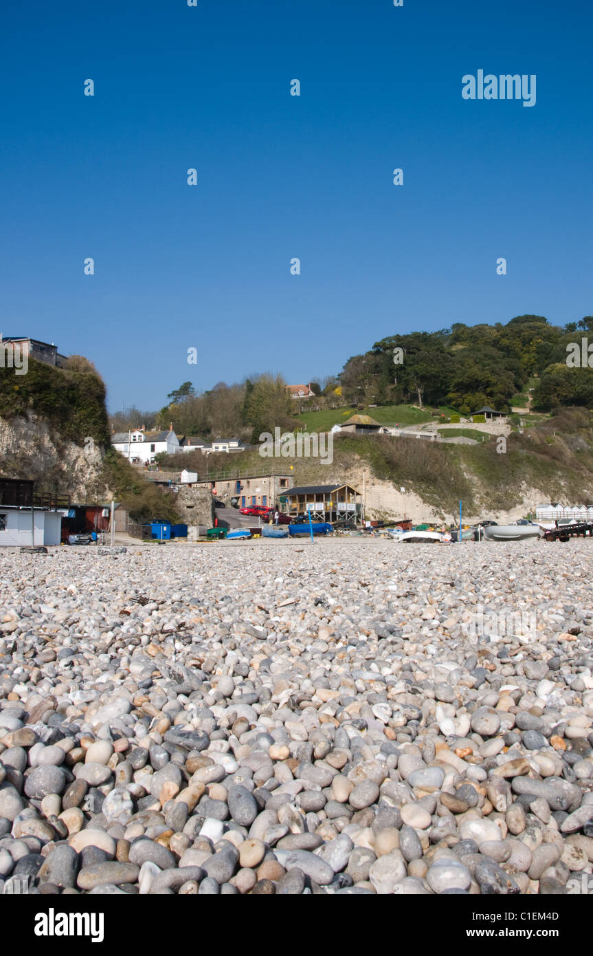 Pebbles and boats on the beach at Beer in Devon, England, UK Stock ...