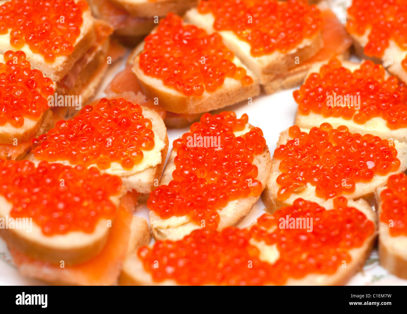 Sandwiches with red roe on white plate Stock Photo - Alamy