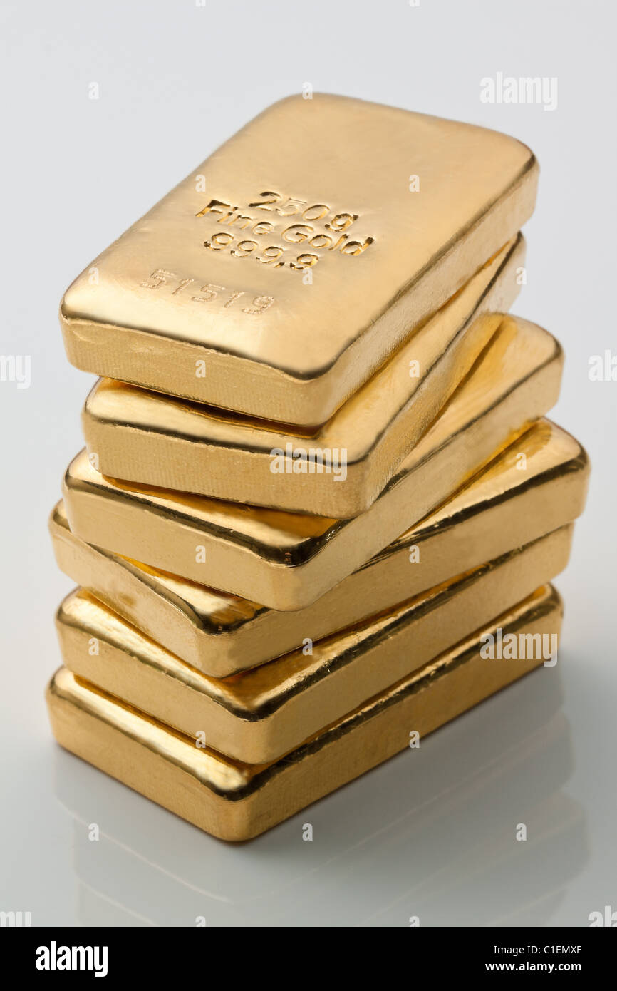 Investing in real gold than gold bullion and gold coins Stock Photo - Alamy