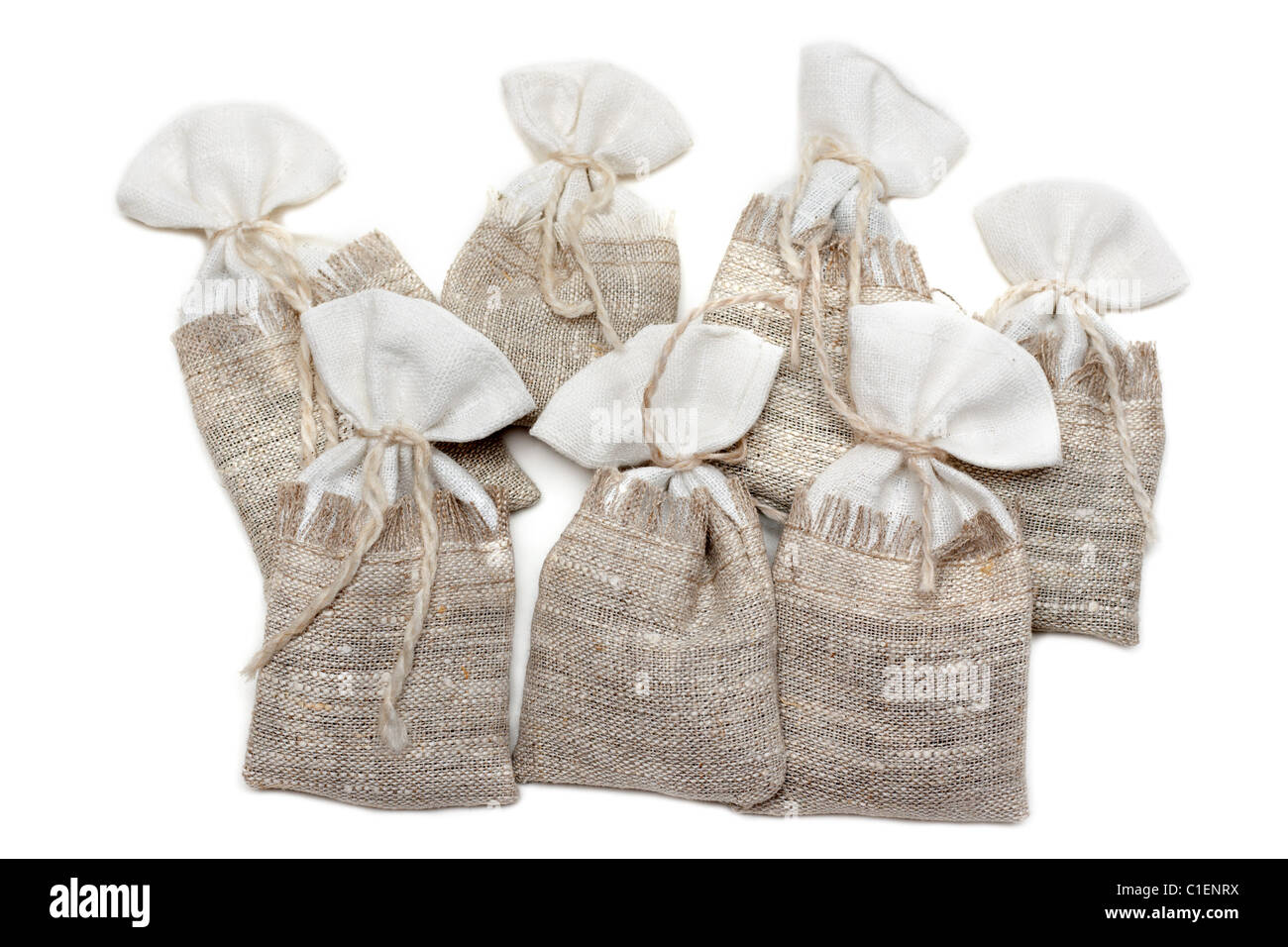 Sac pervaded spice and tied rope on white background Stock Photo - Alamy