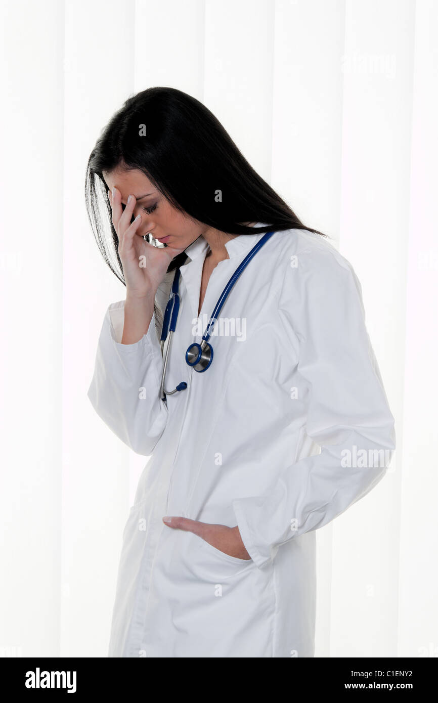 Overburdened doctor at the hospital under stress Stock Photo - Alamy