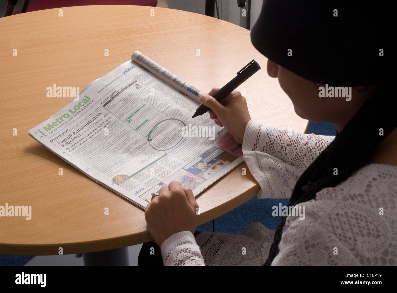 Job Hunting in a Newspaper Stock Photo - Alamy