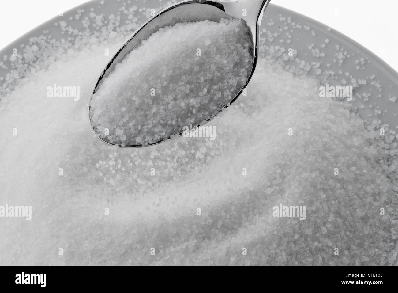 Fine granulated sugar on a spoon Stock Photo - Alamy