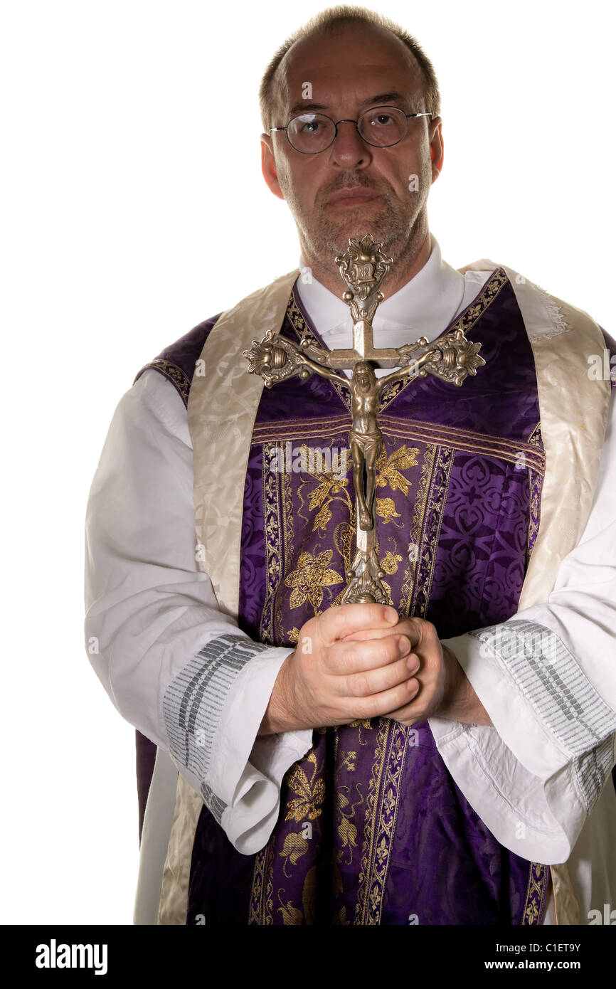 a Catholic priest with a cross in worship Stock Photo - Alamy