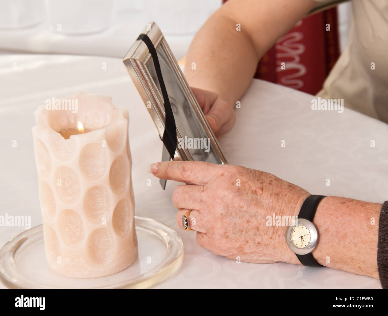 A young woman comforting a widow after event of death. Grief counseling ...