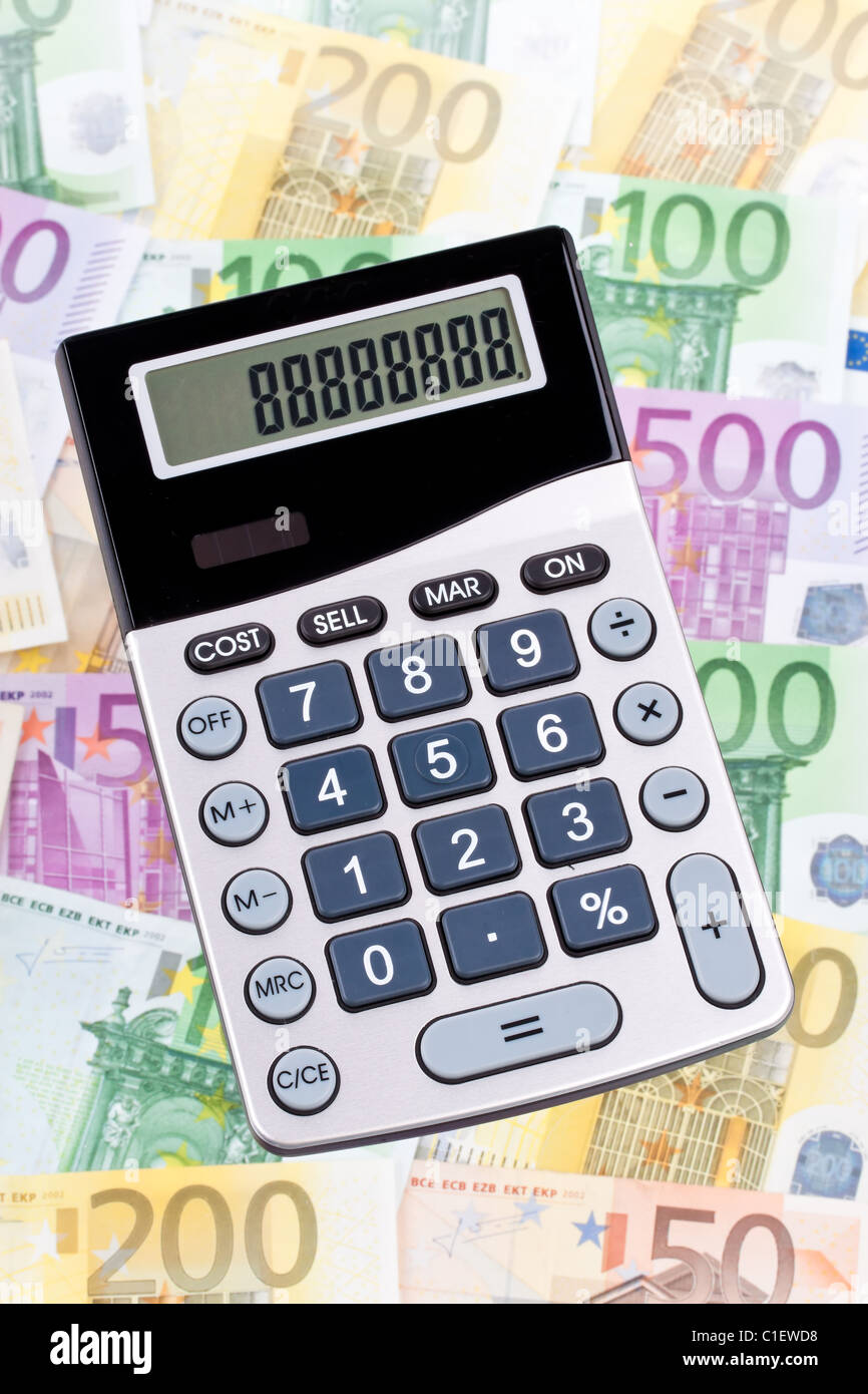 Many Euro notes with calculator Stock Photo - Alamy