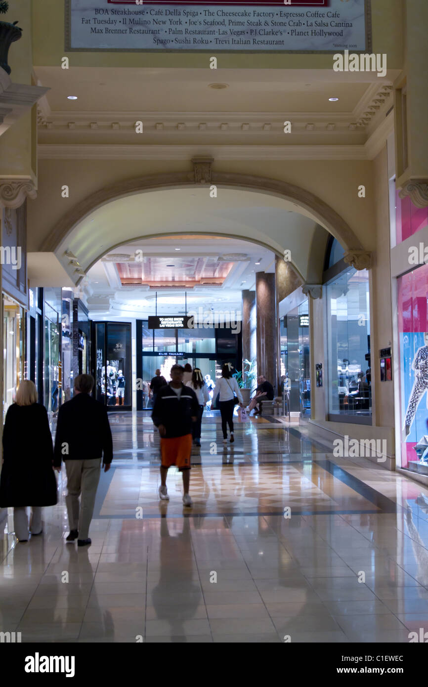 people walking inside shopping mall center Stock Photo - Alamy