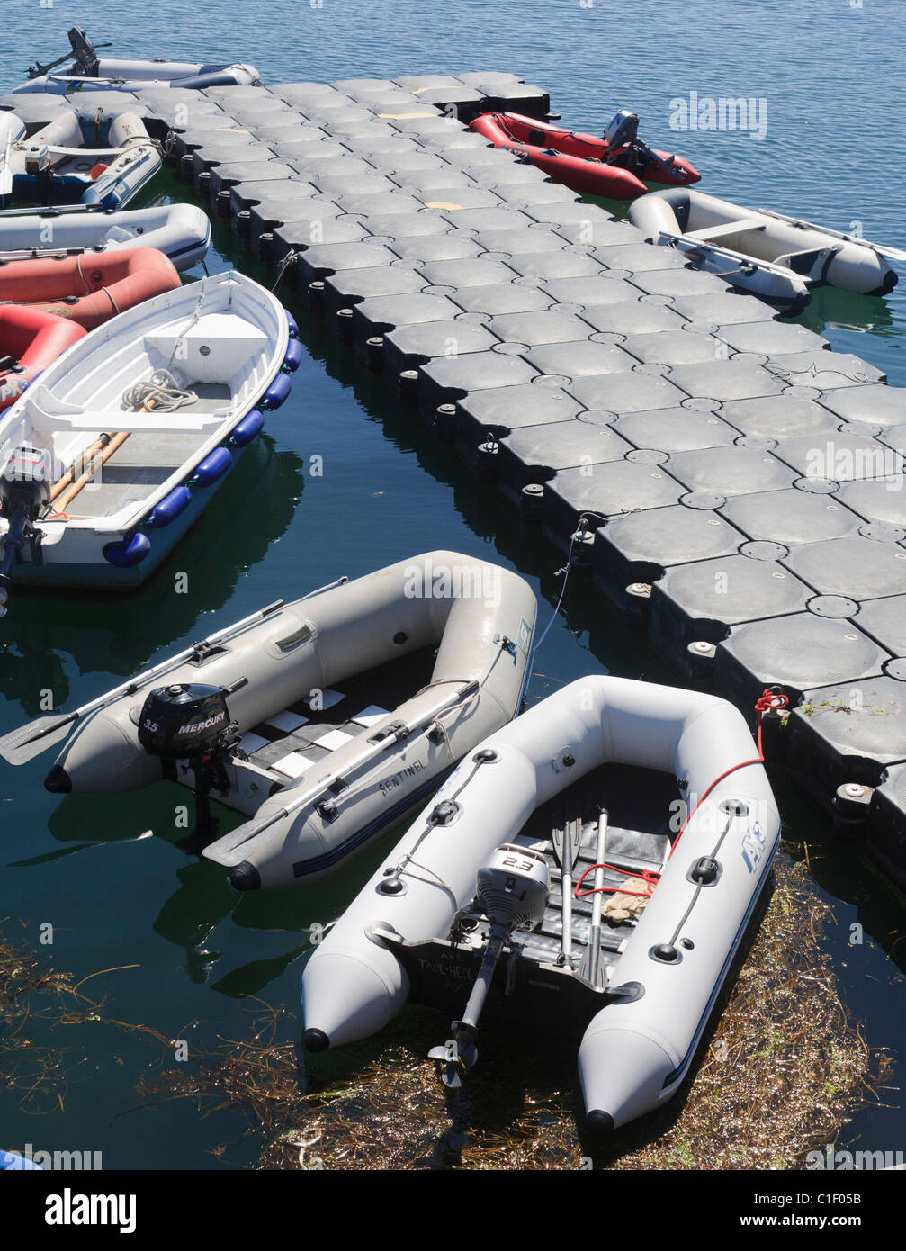 Small boats tied up to a floating modular quay on St.Mary's Isles of ...