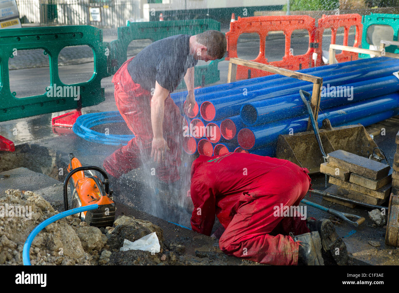 Workmen Repairing a Burst Water Main Stock Photo - Alamy