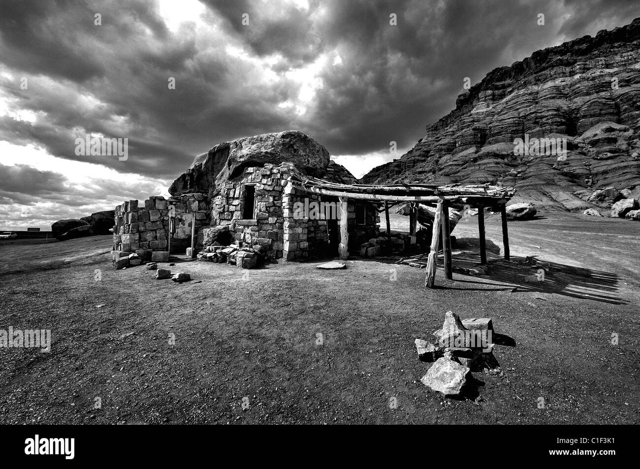 black and white photo of rock house at the vermillion cliffs in arizona ...