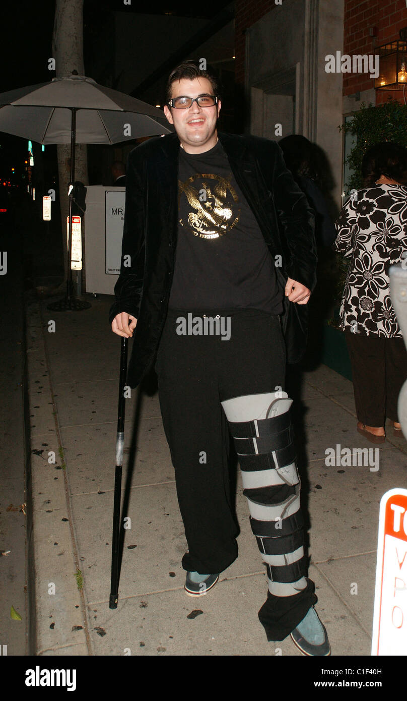Jason Davis shows off his new line of T-shirts as he leaves a ...