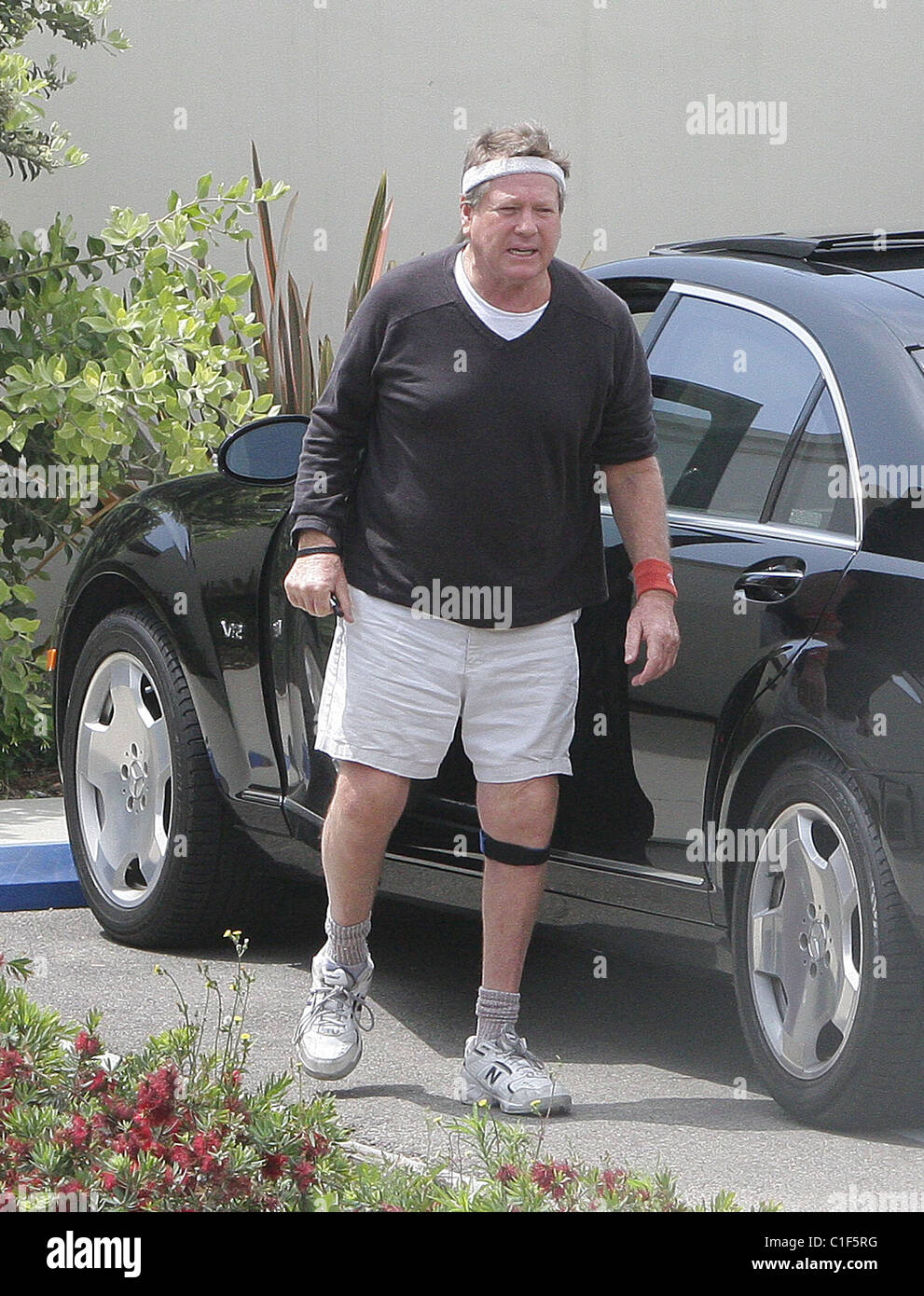 Ryan O'Neal wearing a support bandage on his left leg arrives in good ...