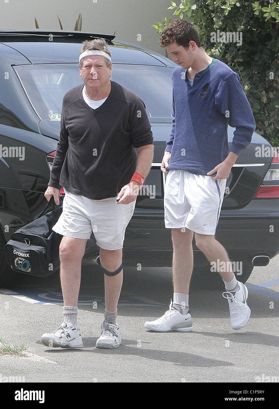 Ryan O'Neal wearing a support bandage on his left leg arrives in good ...