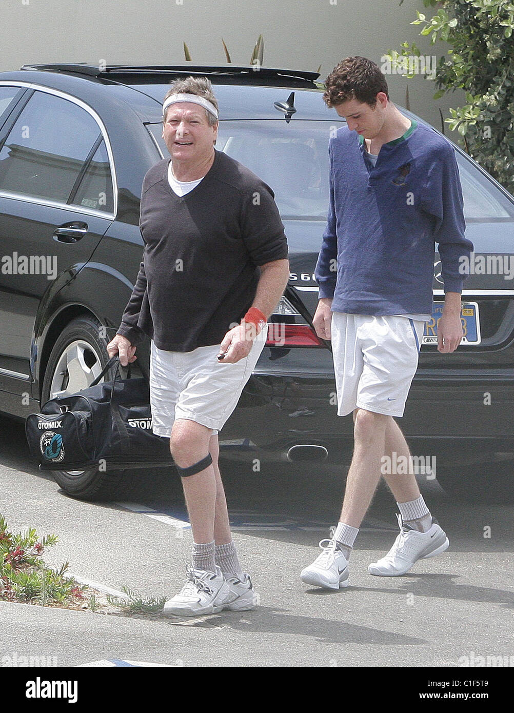 Ryan O'Neal wearing a support bandage on his left leg arrives in good ...