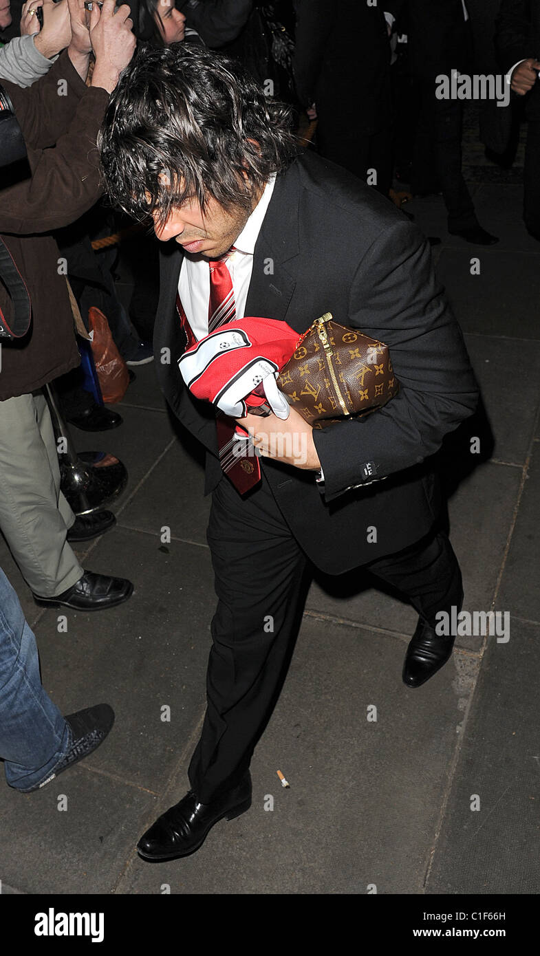 Manchester United striker Carlos Tevez arrives back at the teams hotel ...