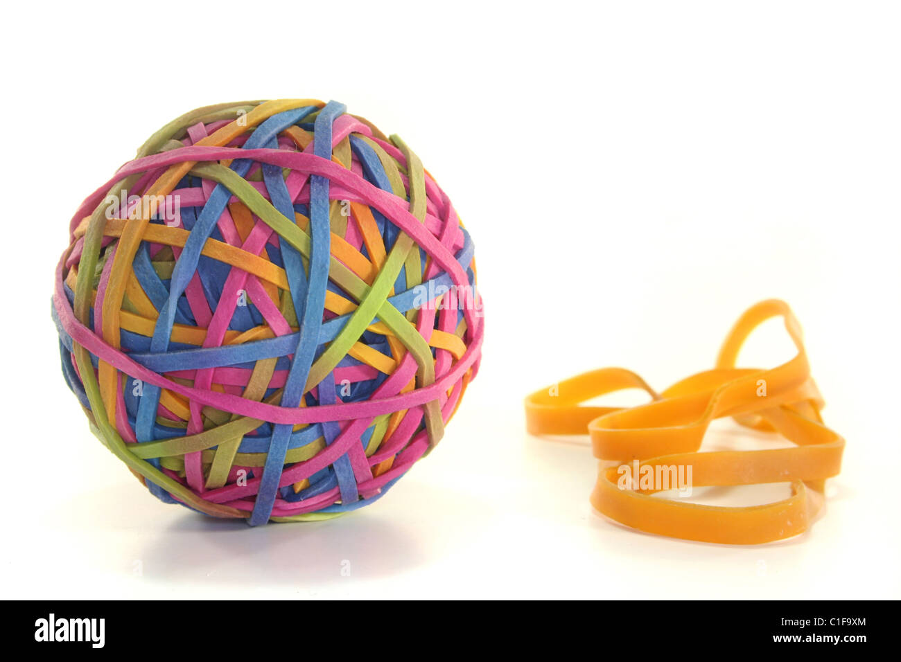Rubber ball of different colored rubber against white background Stock ...