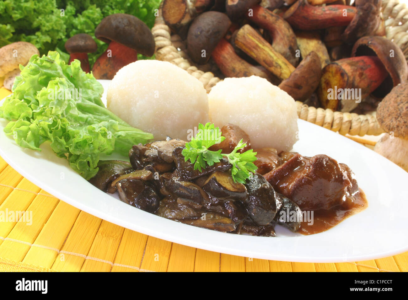 Game goulash with dumplings and fresh mushrooms Stock Photo - Alamy