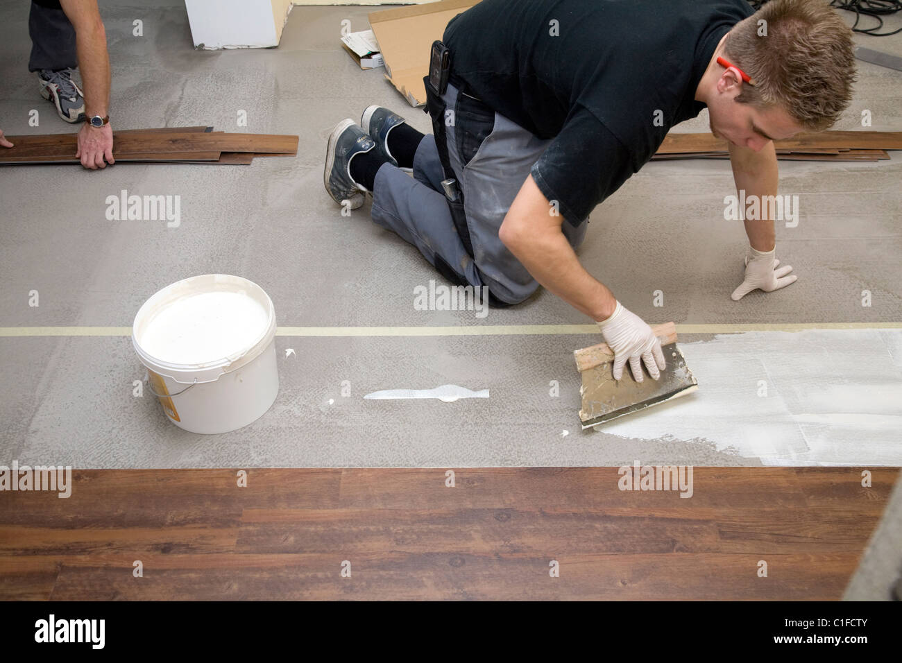 An interior designer laying the flooring Stock Photo - Alamy