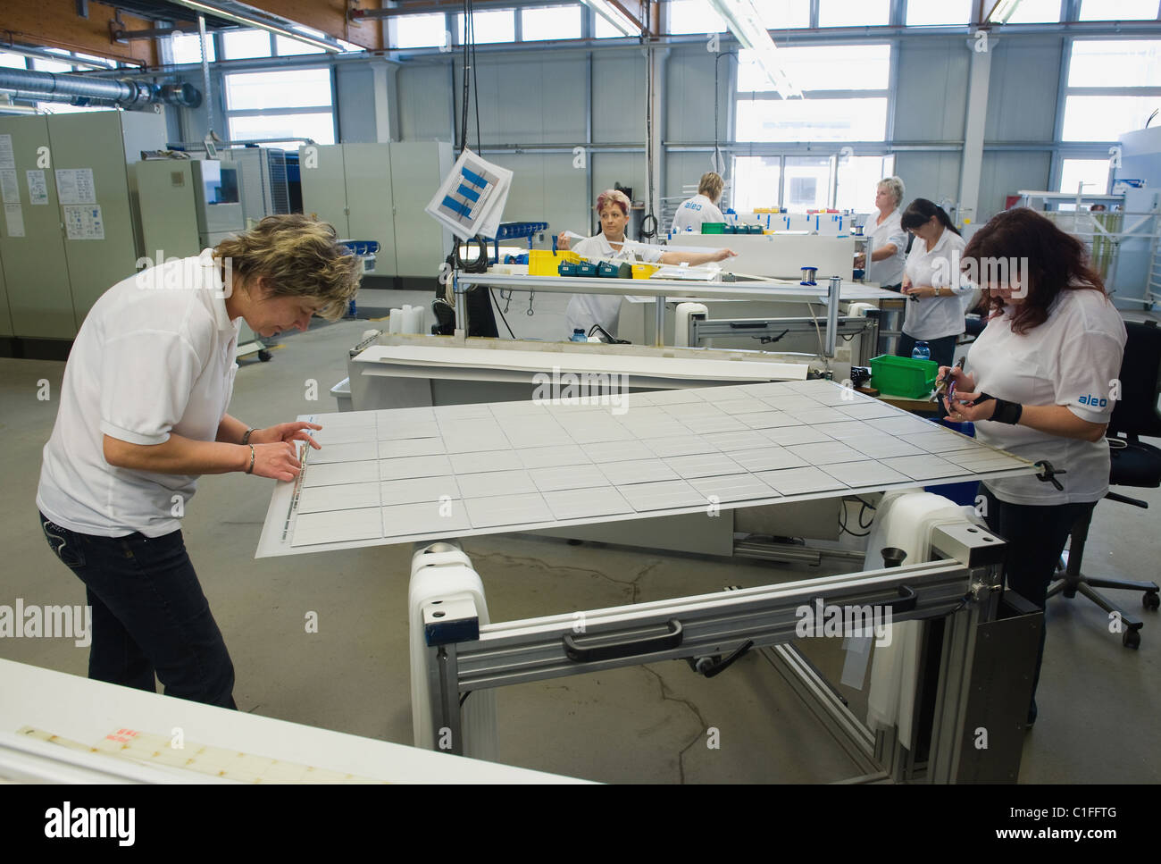 Quality control and connection of contacts, Prenzlau, Germany Stock ...