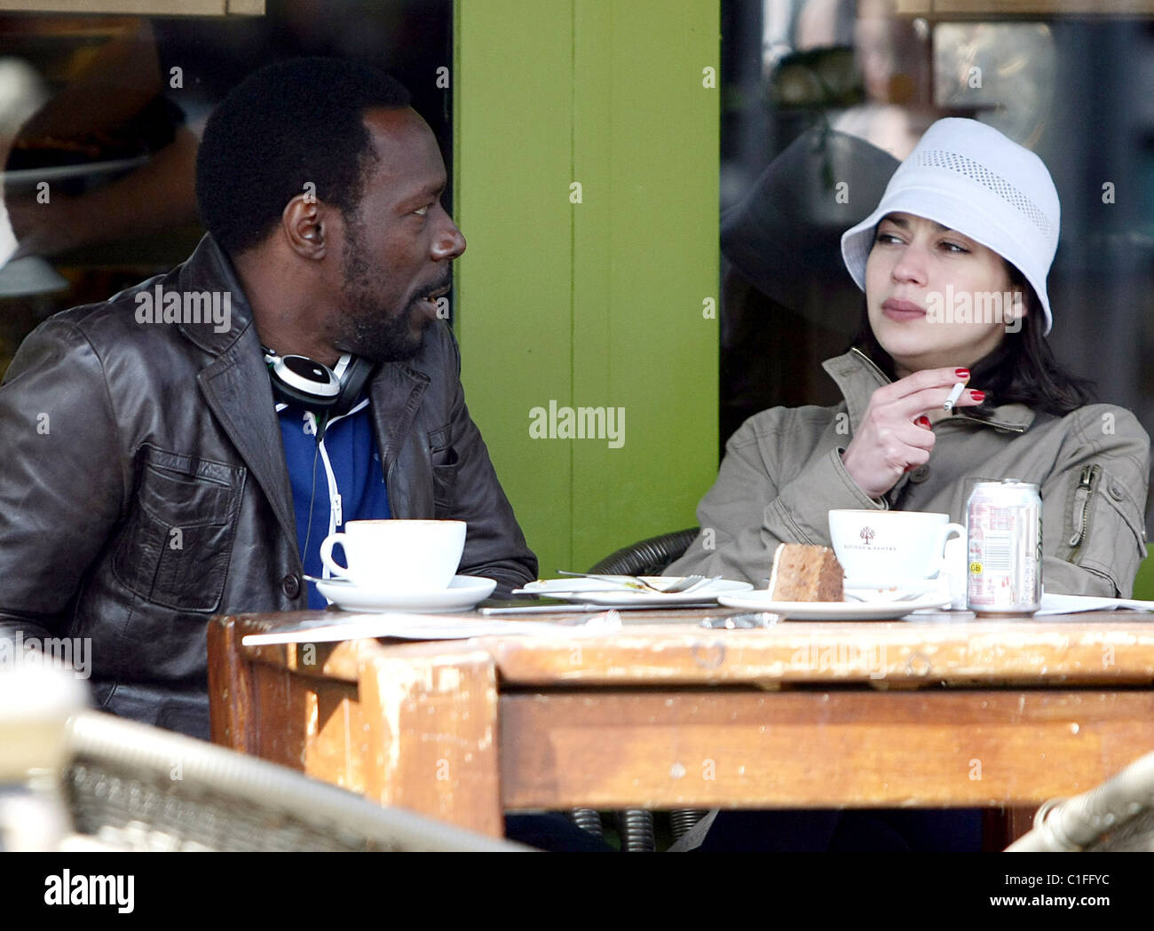 Gary Beadle sits outside a cafe on the Portobello road with a female ...