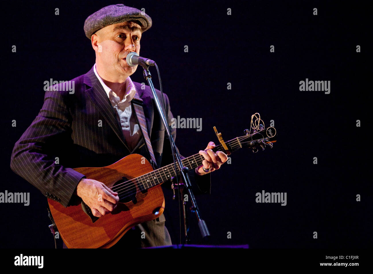 John Watts lead singer of band Fischer-Z performing live on stage at ...