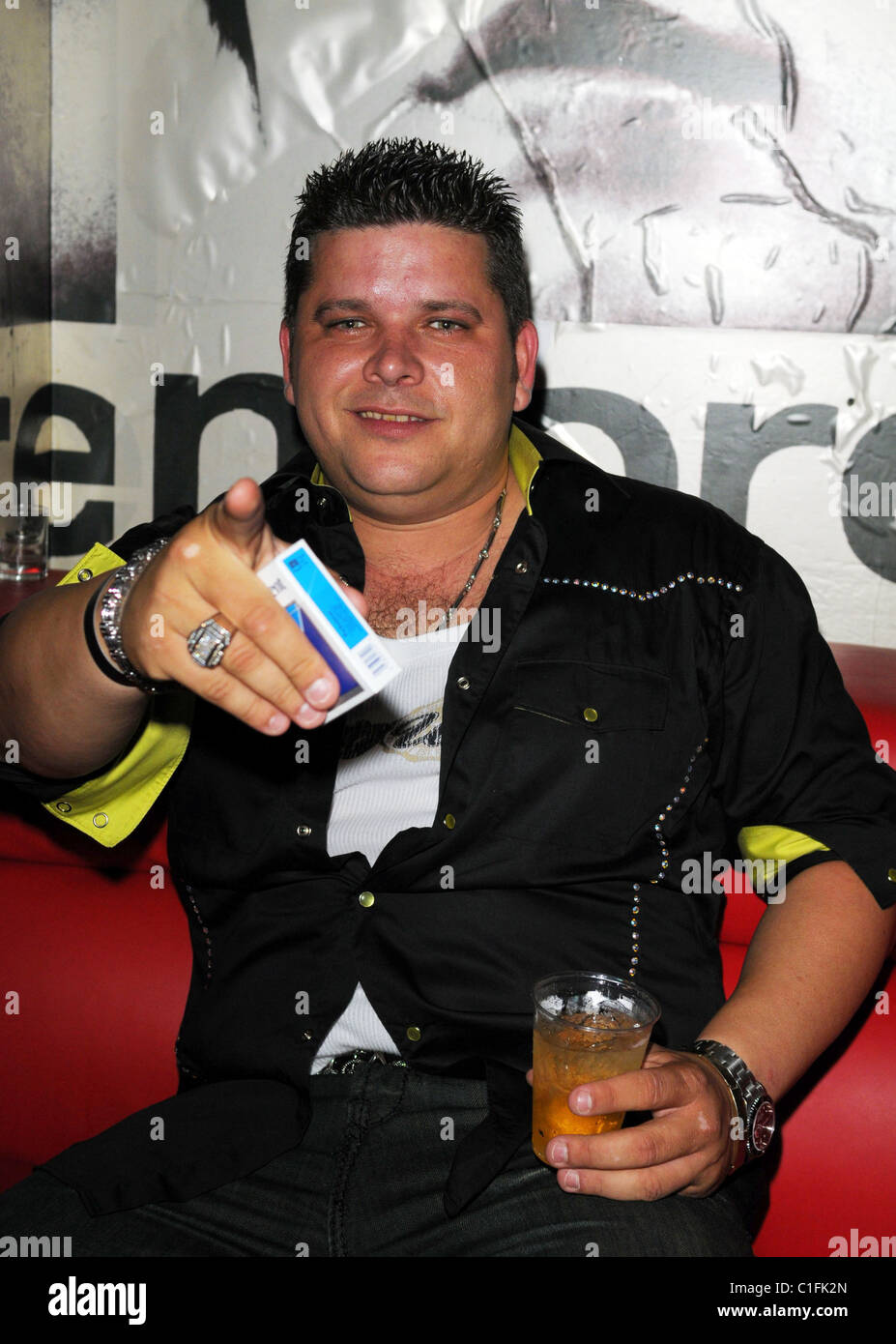 Latin singer Marcos Domenech relaxes in the VIP area after performing ...