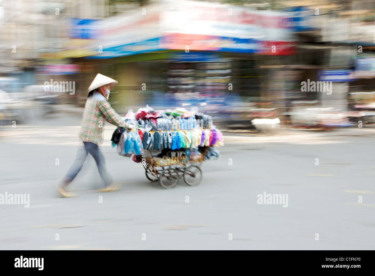 Mobile shoe shop on the move in Hanoi, Vietnam Stock Photo - Alamy