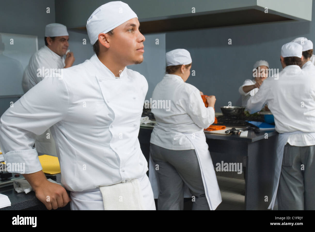 Bakers working in bakery kitchen Stock Photo - Alamy