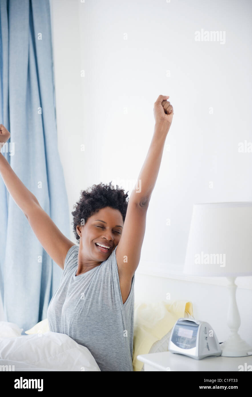 Black woman waking up in the morning Stock Photo - Alamy