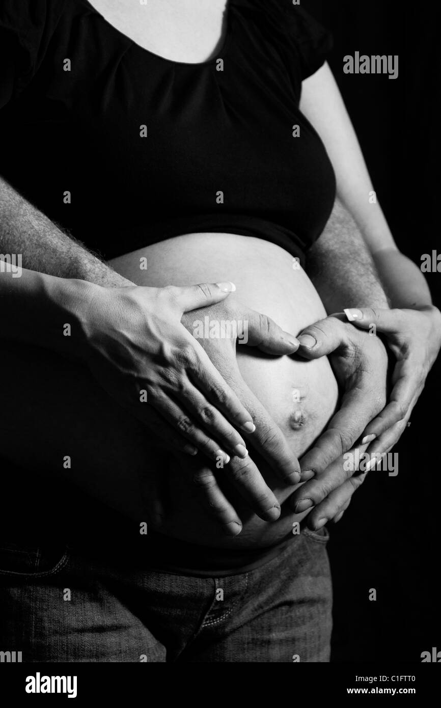 Hands on Belly Stock Photo - Alamy