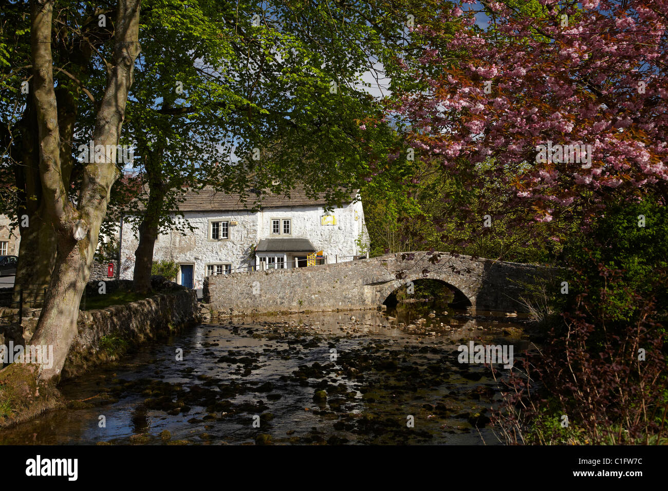 Bridge over Malham Beck stream, Malham, North Yorkshire, England ...