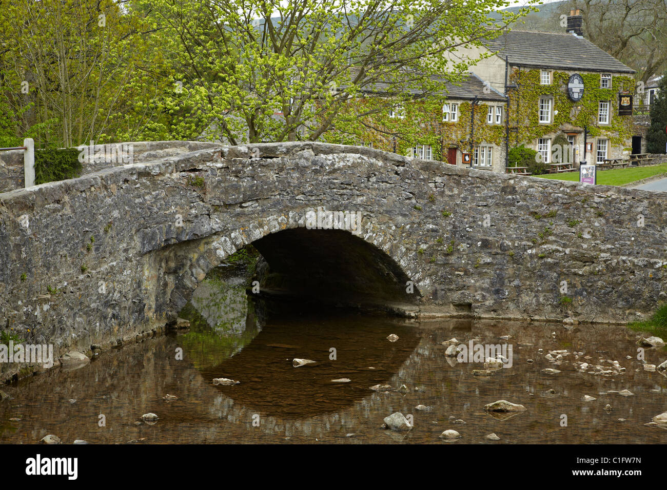Bridge over Malham Beck stream, Malham, North Yorkshire, England ...