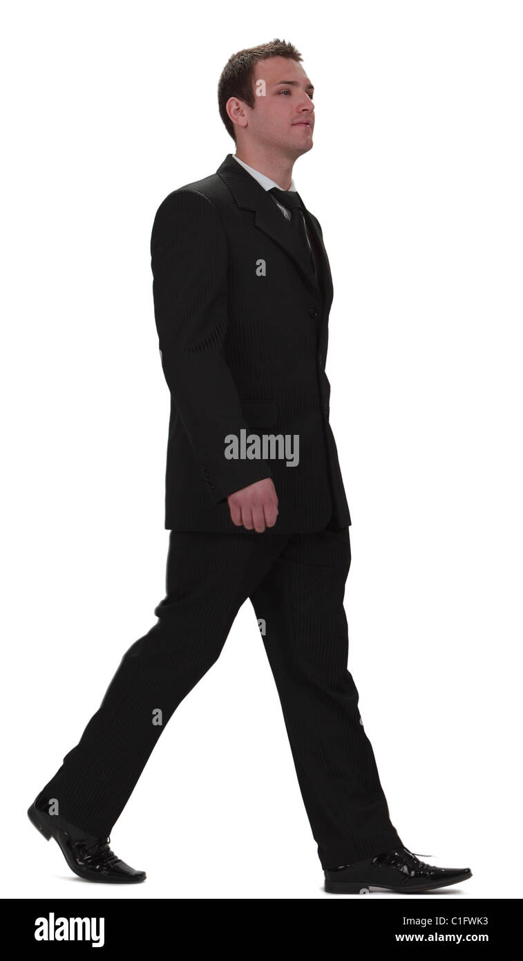 Image of a young businessman walking, isolated against a white ...