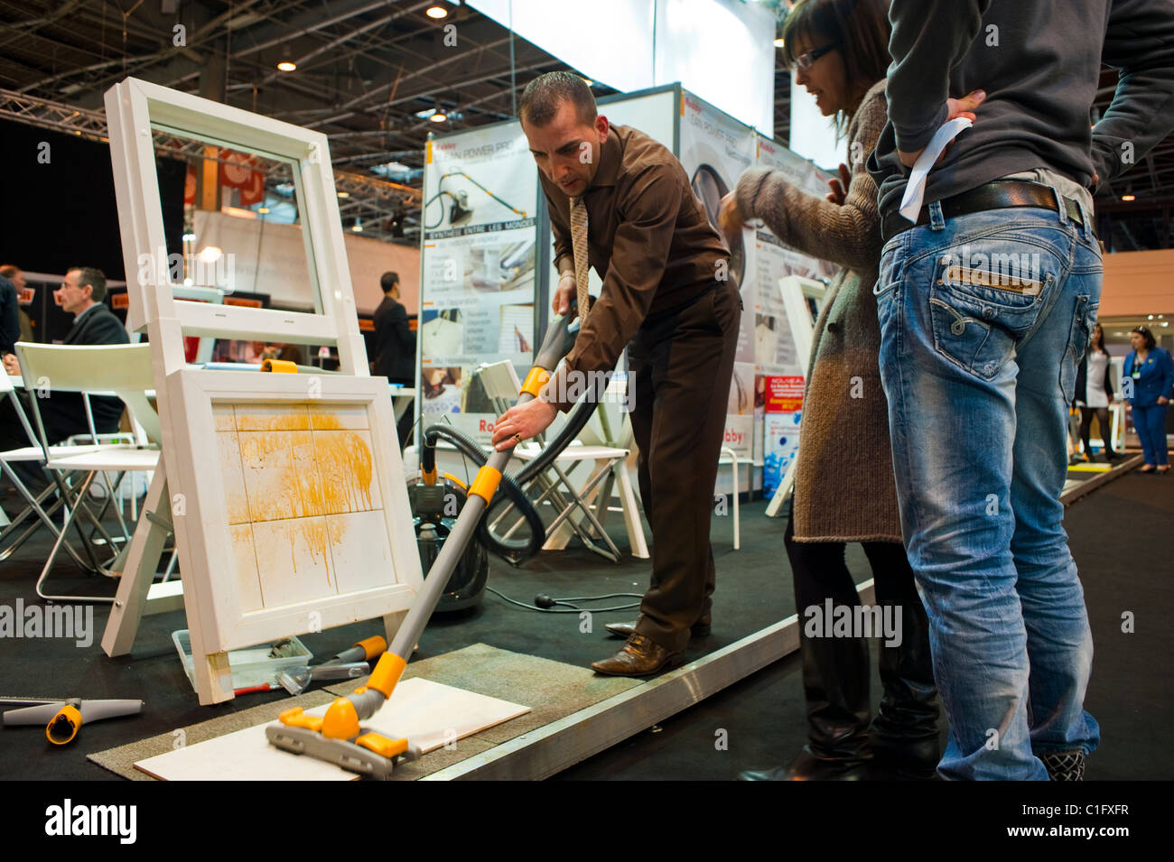Man Demonstrating Vacuum Cleaner at Home Improvements Trade Show, Home ...