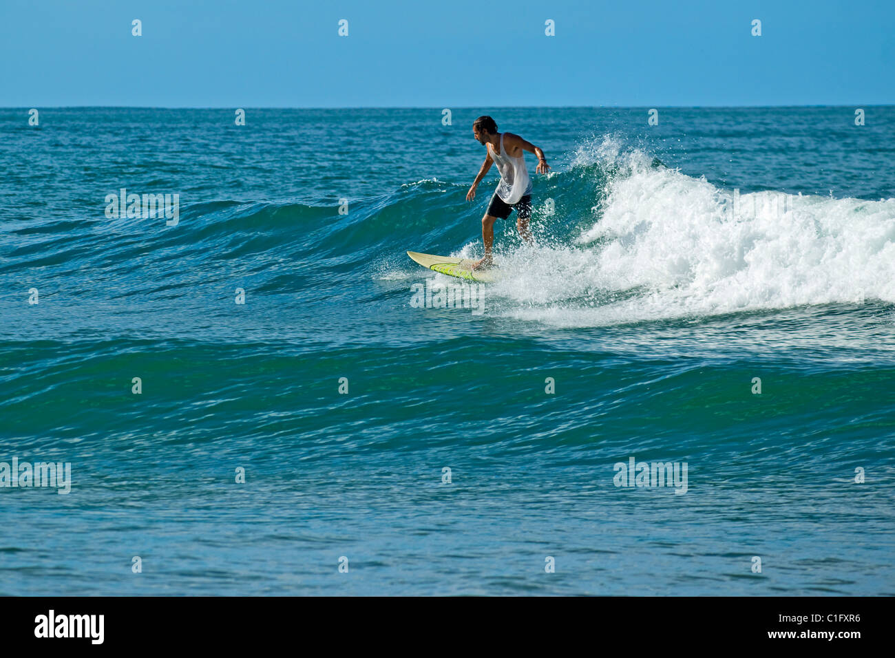 Shortboard surfer riding wave by Playa Guiones at this popular ...